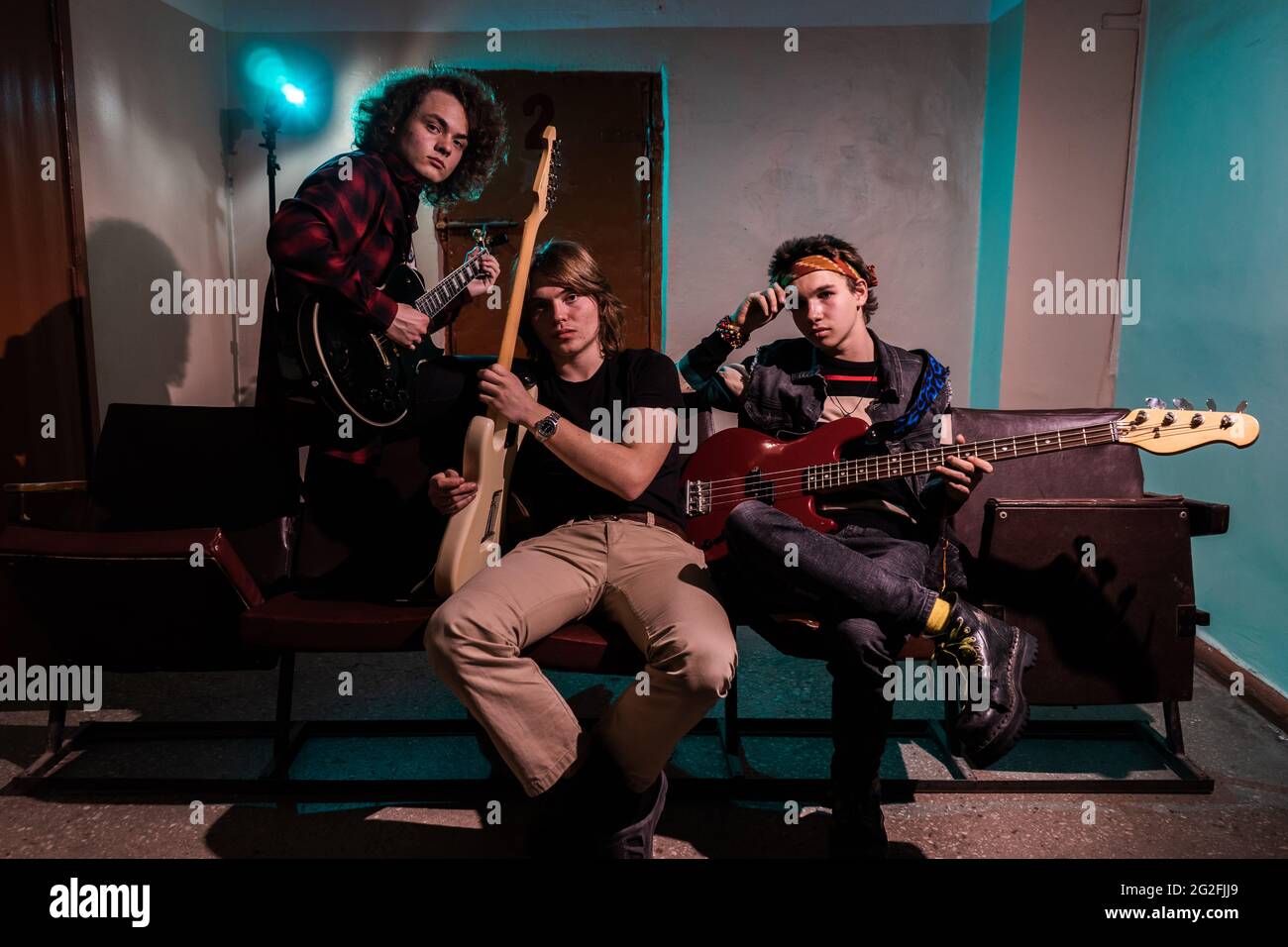 Music and fashion. Group portrait of musicians. Handsome young men ...