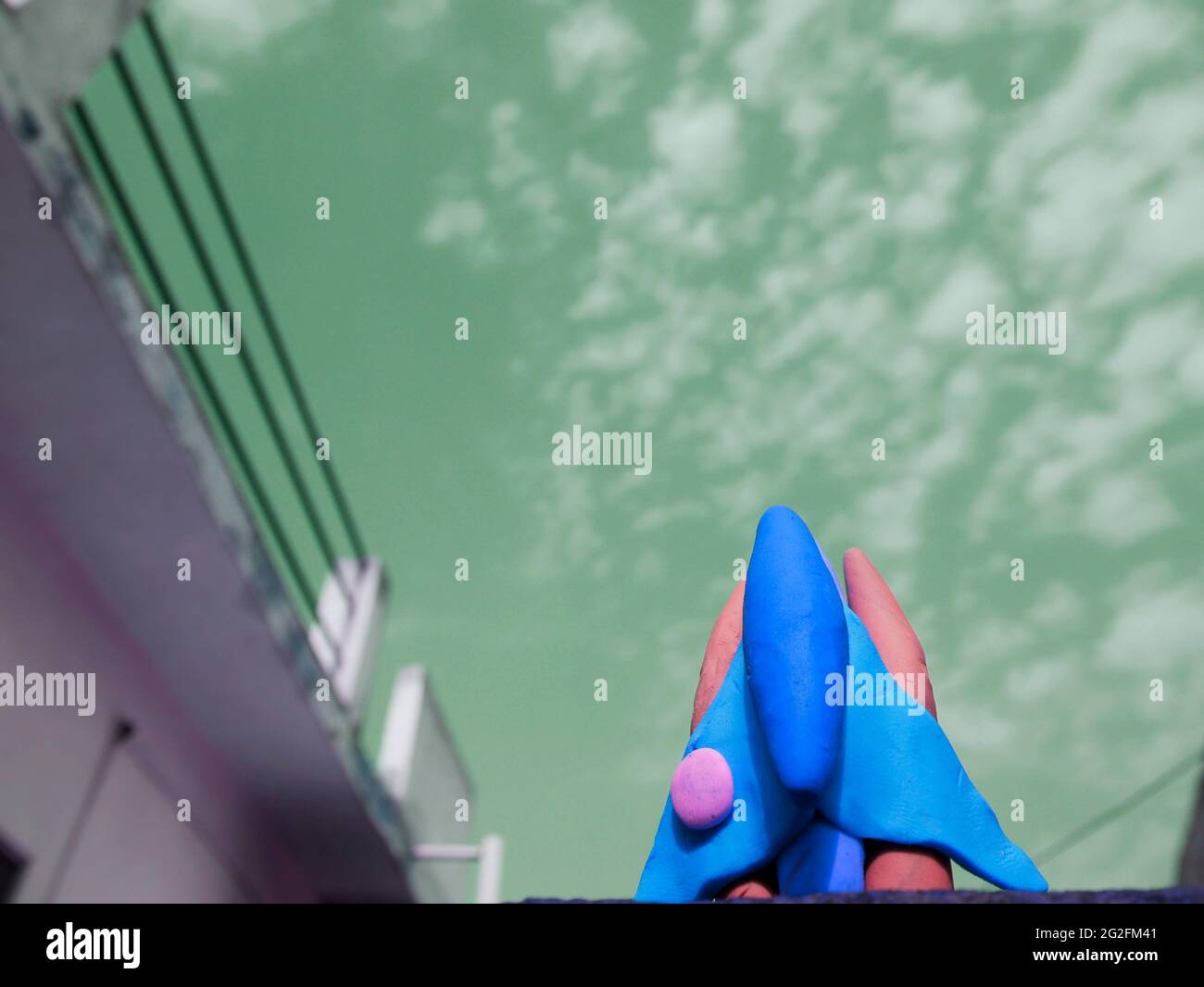 Blue color clay space craft on turquoise colour sky behind the object ...