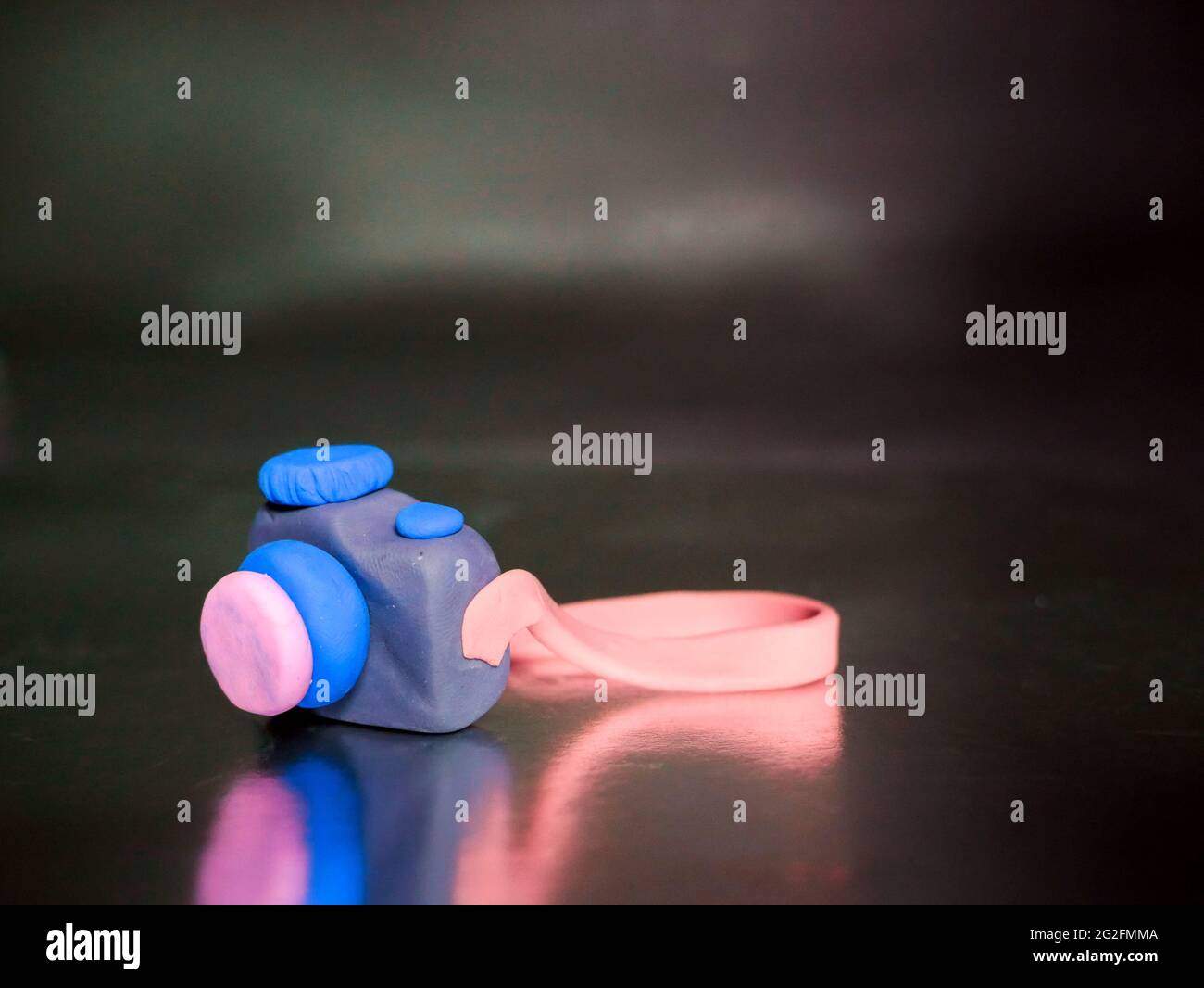 Beautiful clay camera isolate on silver background Stock Photo - Alamy