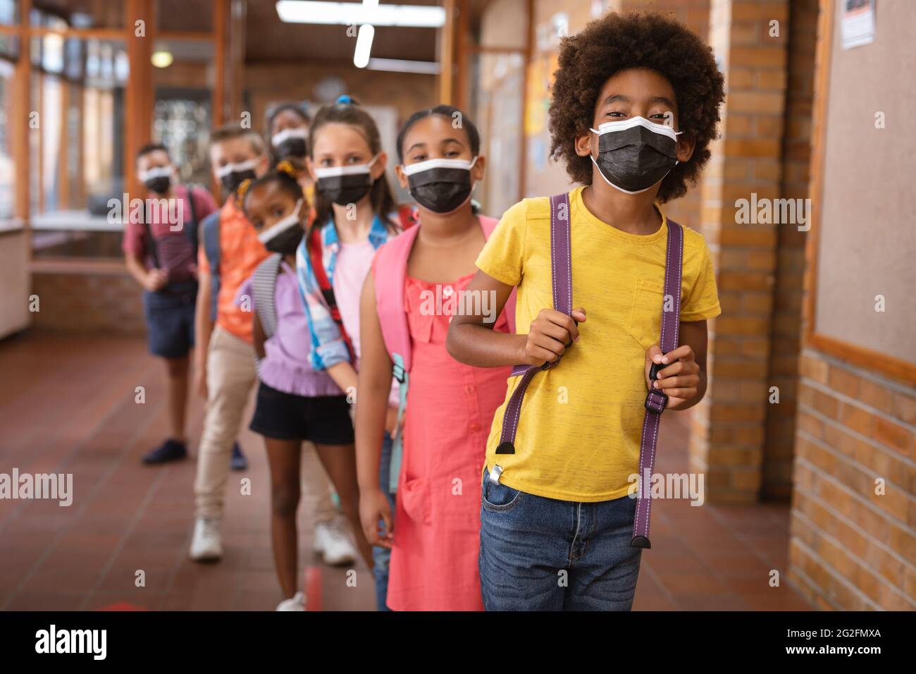 Diverse group of students wearing mask hi-res stock photography and ...