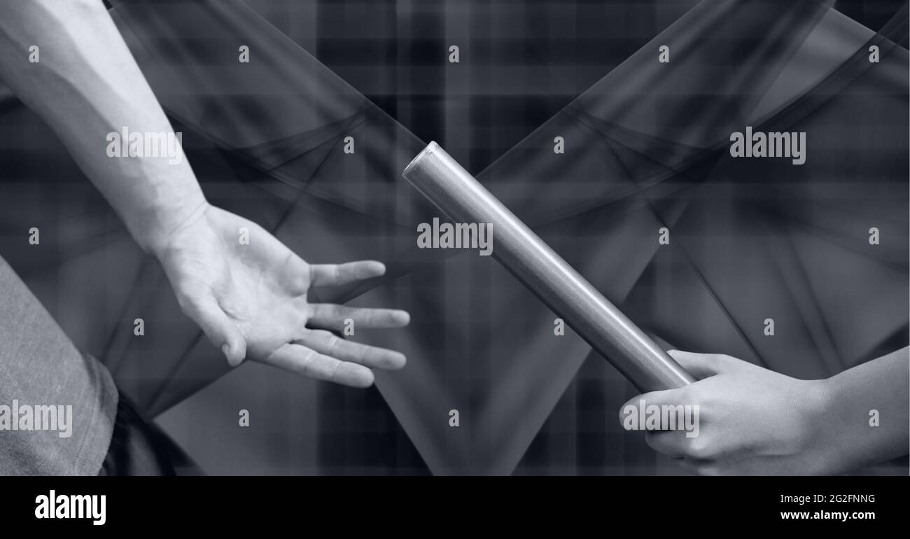Black and white image of close up of hand passing a baton against ...