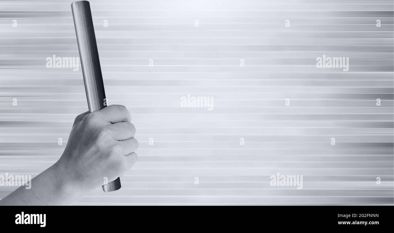 Black and white image of close up of hand holding a baton against ...