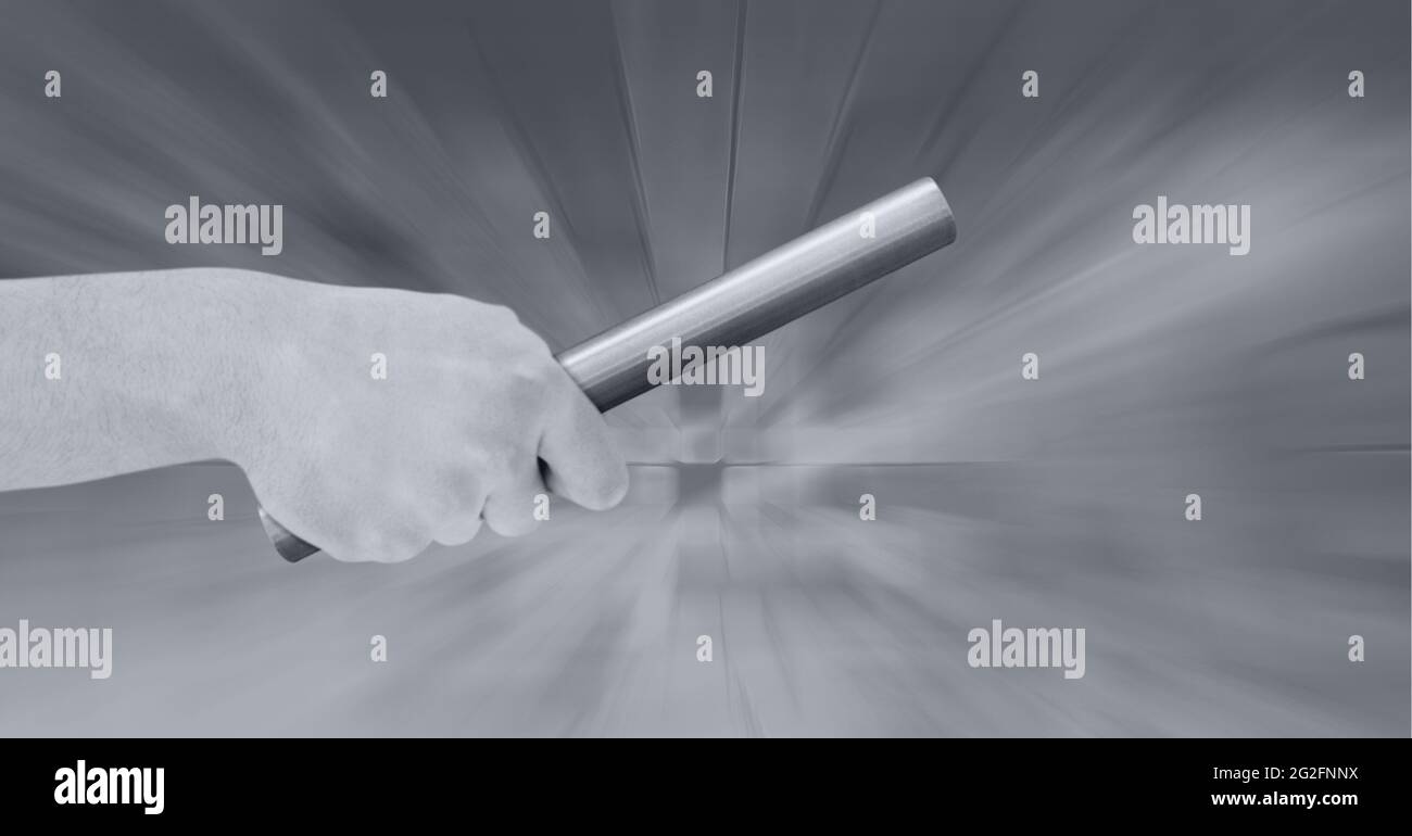Black and white image of close up of hand holding a baton against grey ...