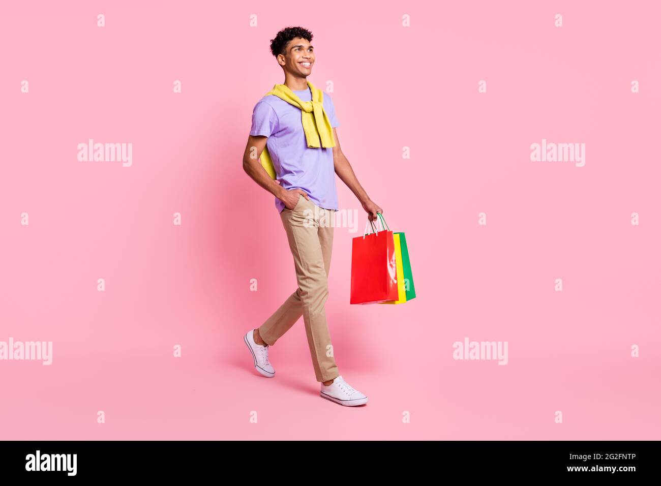 Full size photo of young handsome smiling afro man go shopping wear ...