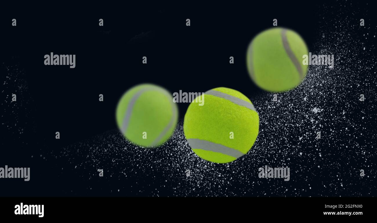 Composition of tennis balls on black background with light trails Stock ...