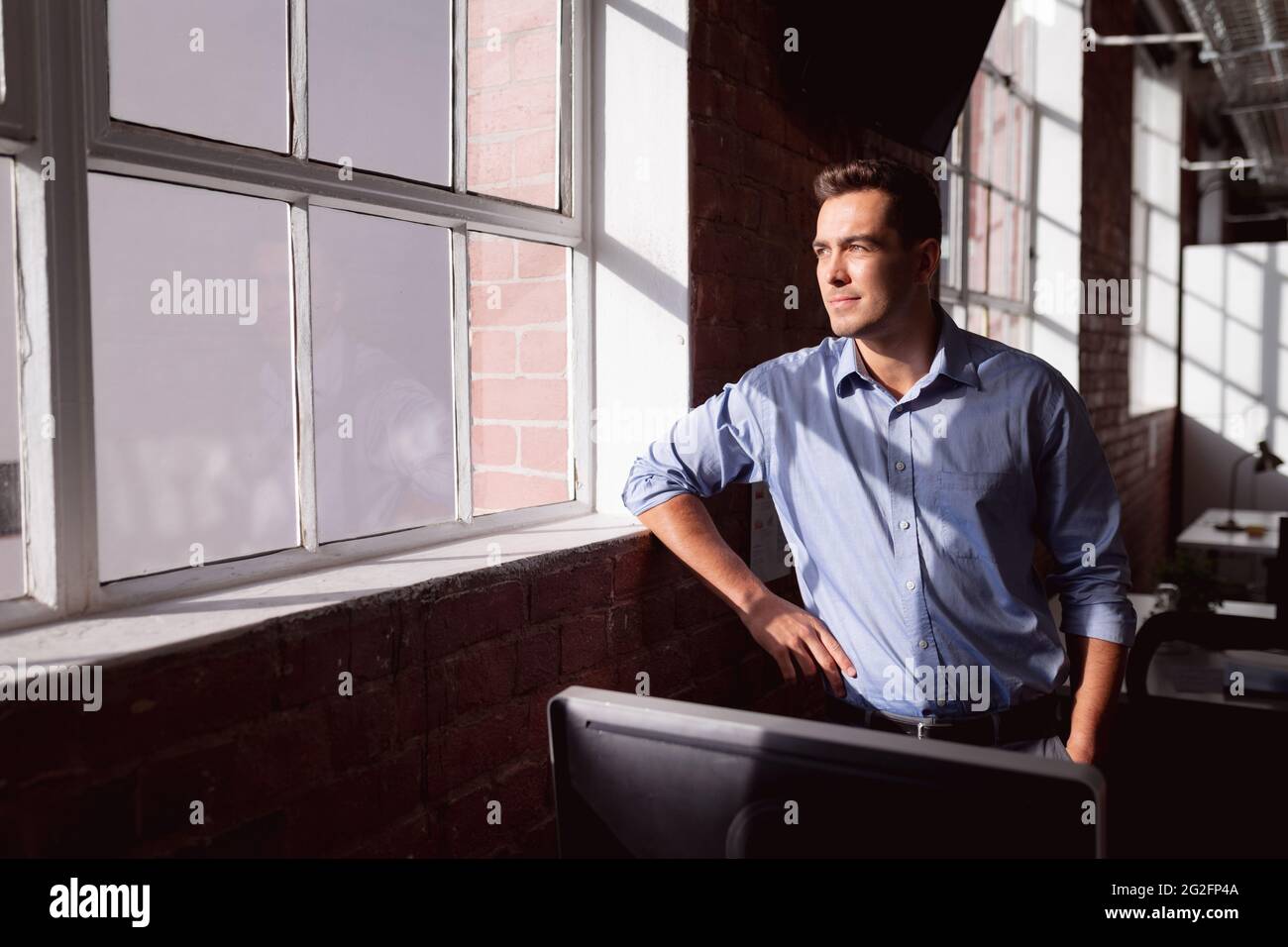 Person looking out of office window hi-res stock photography and images ...