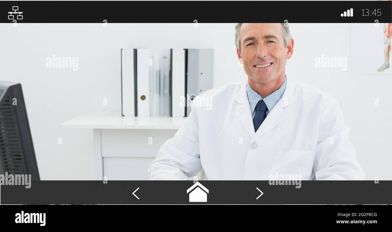 Composition of male doctor smiling on digital image interface screen ...