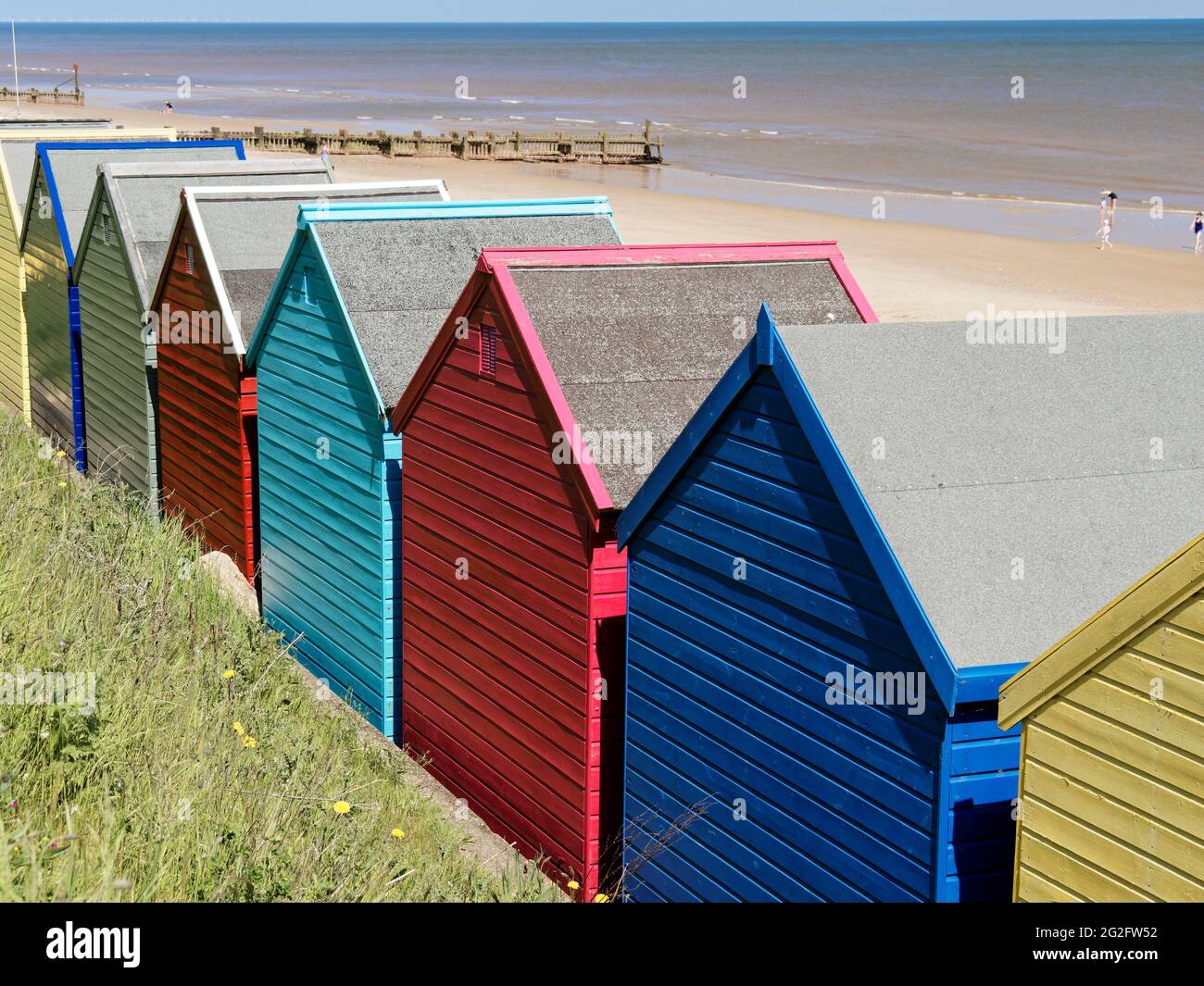 Beach huts and the safe sandy beach at Mundesley, a small seaside ...