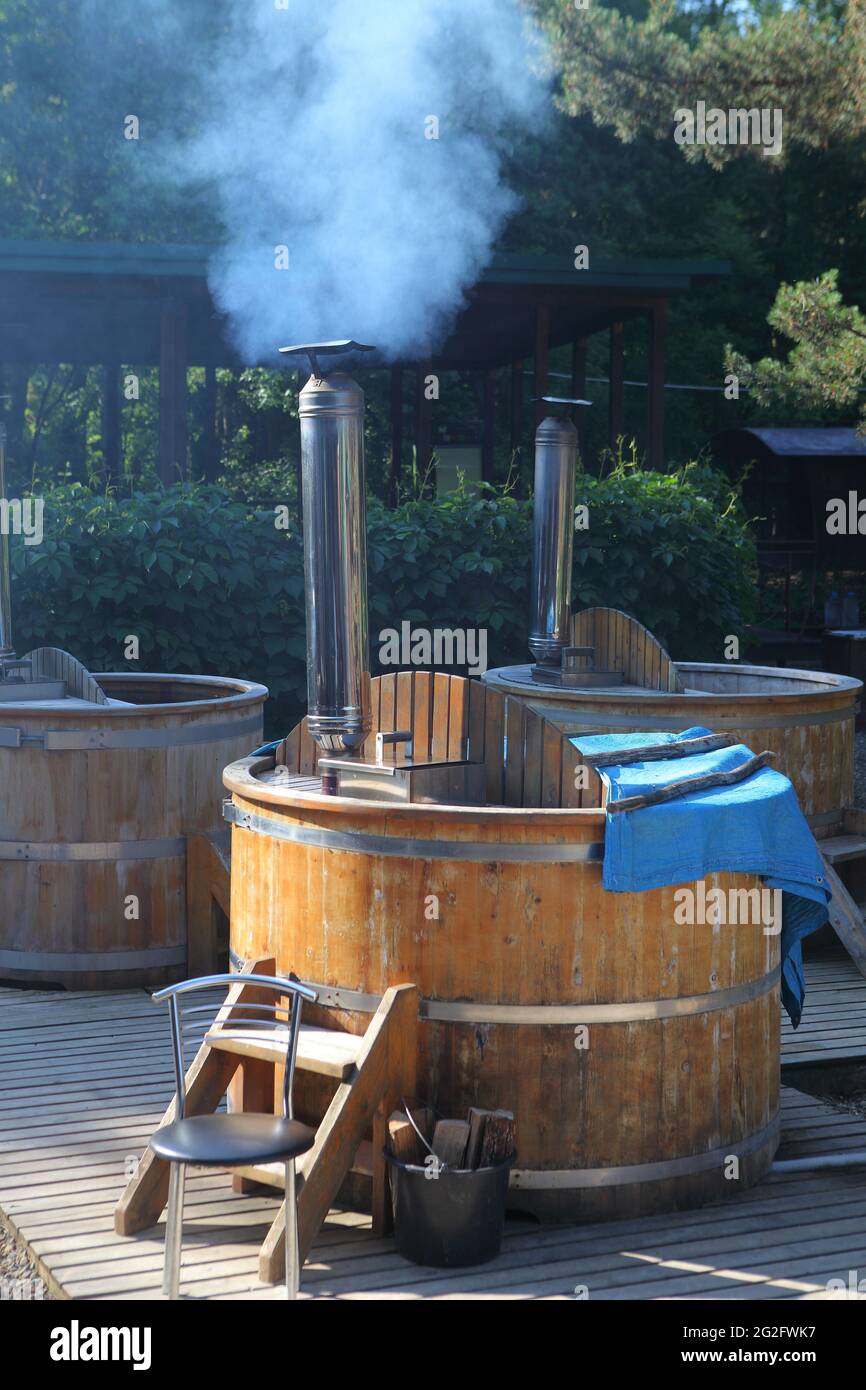 Wooden phyto tub with water with herbal decoction Stock Photo - Alamy