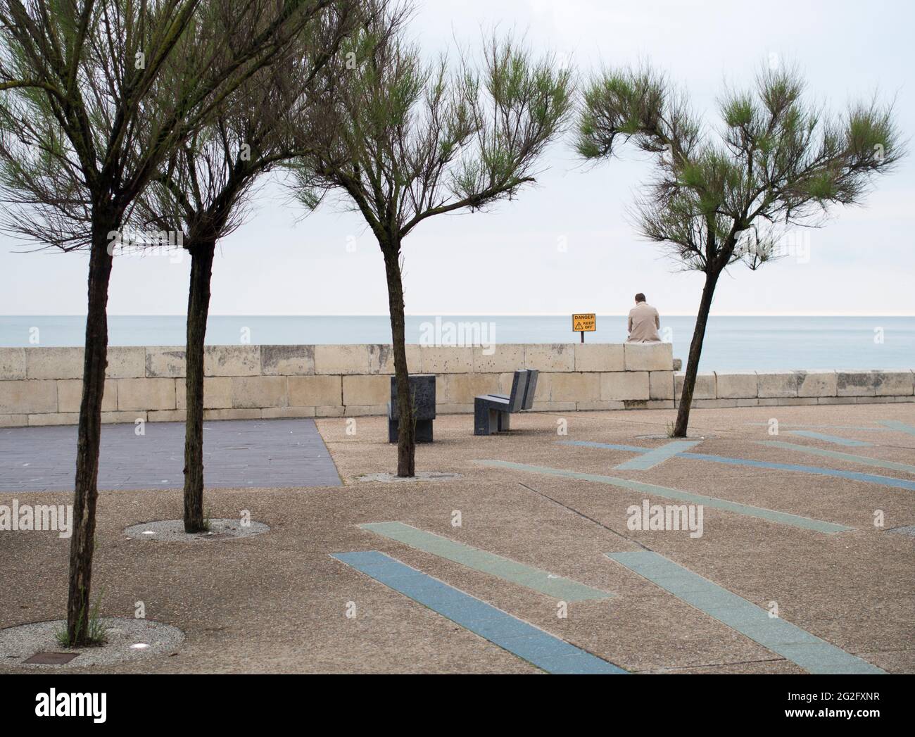Lone Figure Looking Out To Sea High Resolution Stock Photography and ...