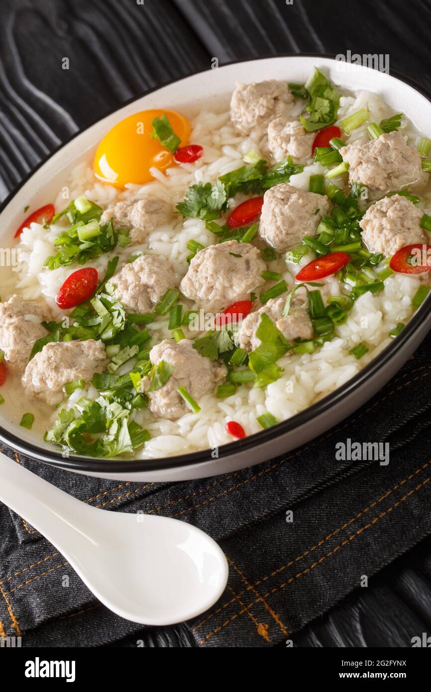 Authentic Khao tom moo Thai Rice Soup with Minced Pork closeup in the ...