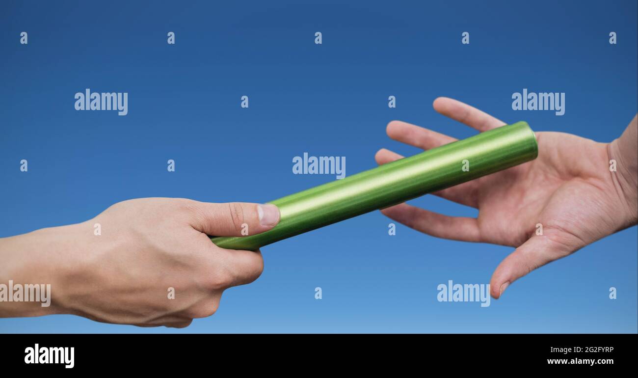 Composition of caucasian athletes passing green relay baton over blue ...