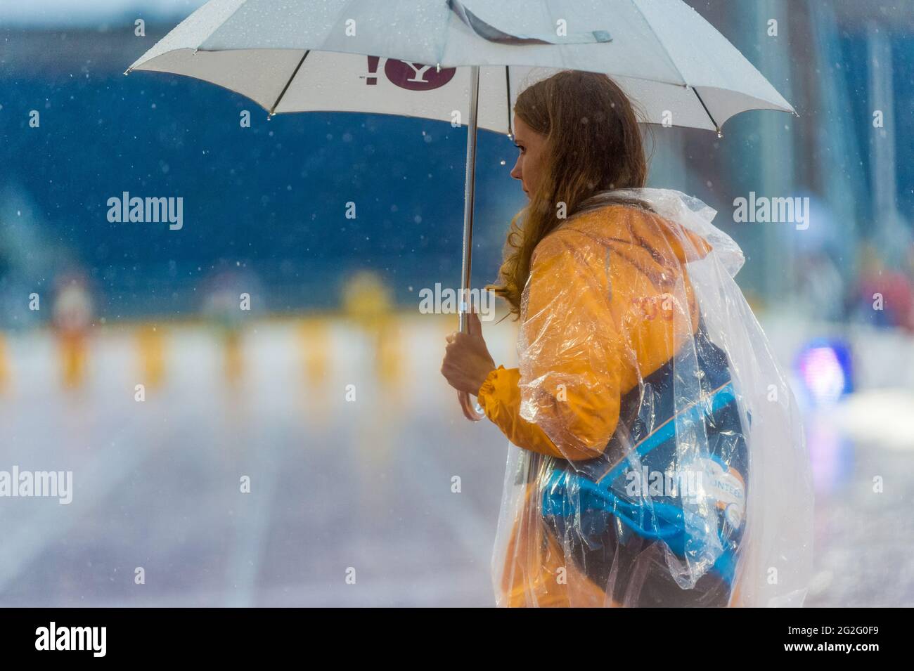 The volunteers on the track: Heavy rain kept most spectators under ...