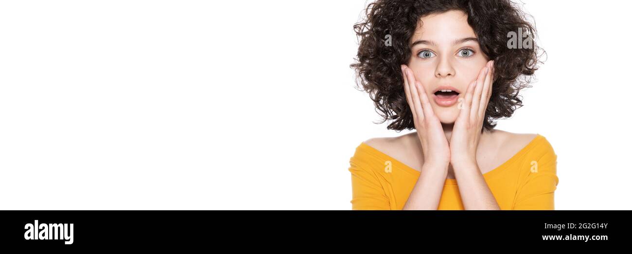Shocked teenager screaming in disbelief, isolated over white background ...