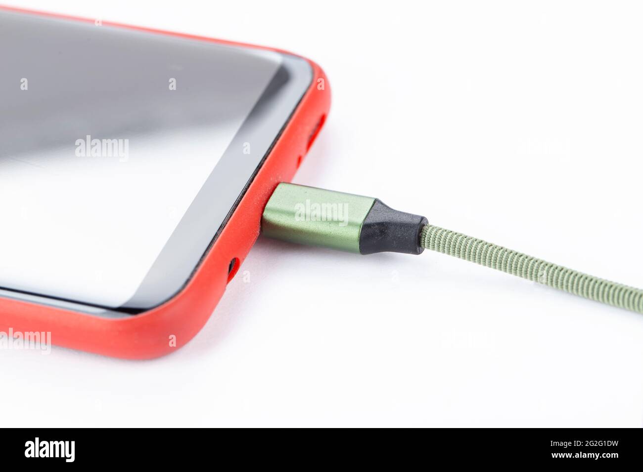 Smartphone Connects to Charger through USB Cable on a white background ...