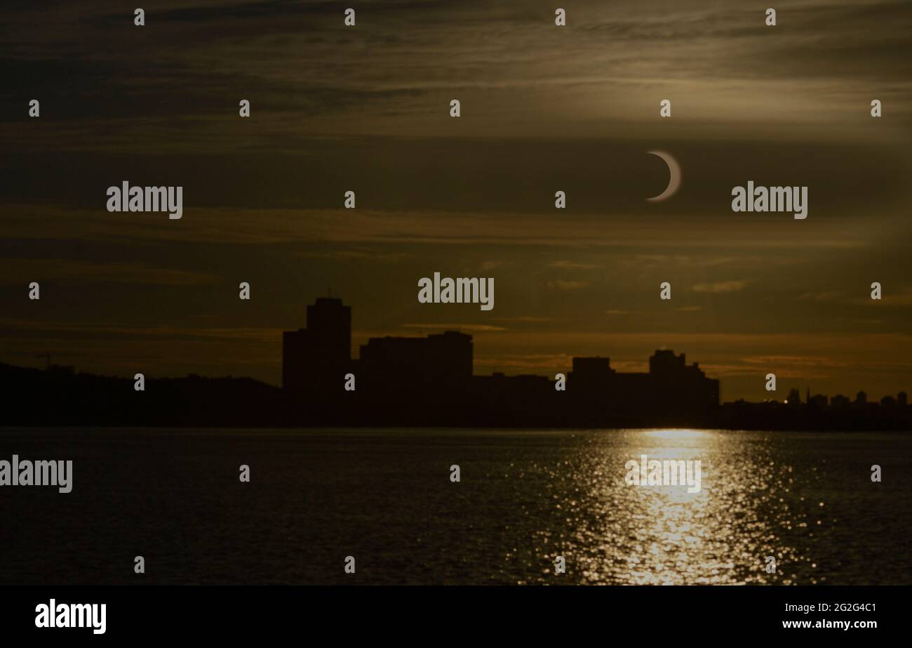 June 10 Solar Eclipse shows a partial eclipse over downtown Ottawa ...