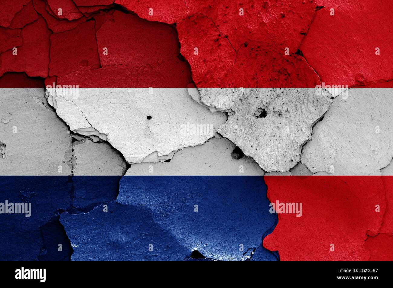 flags of Netherlands and Austria painted on cracked wall Stock Photo ...