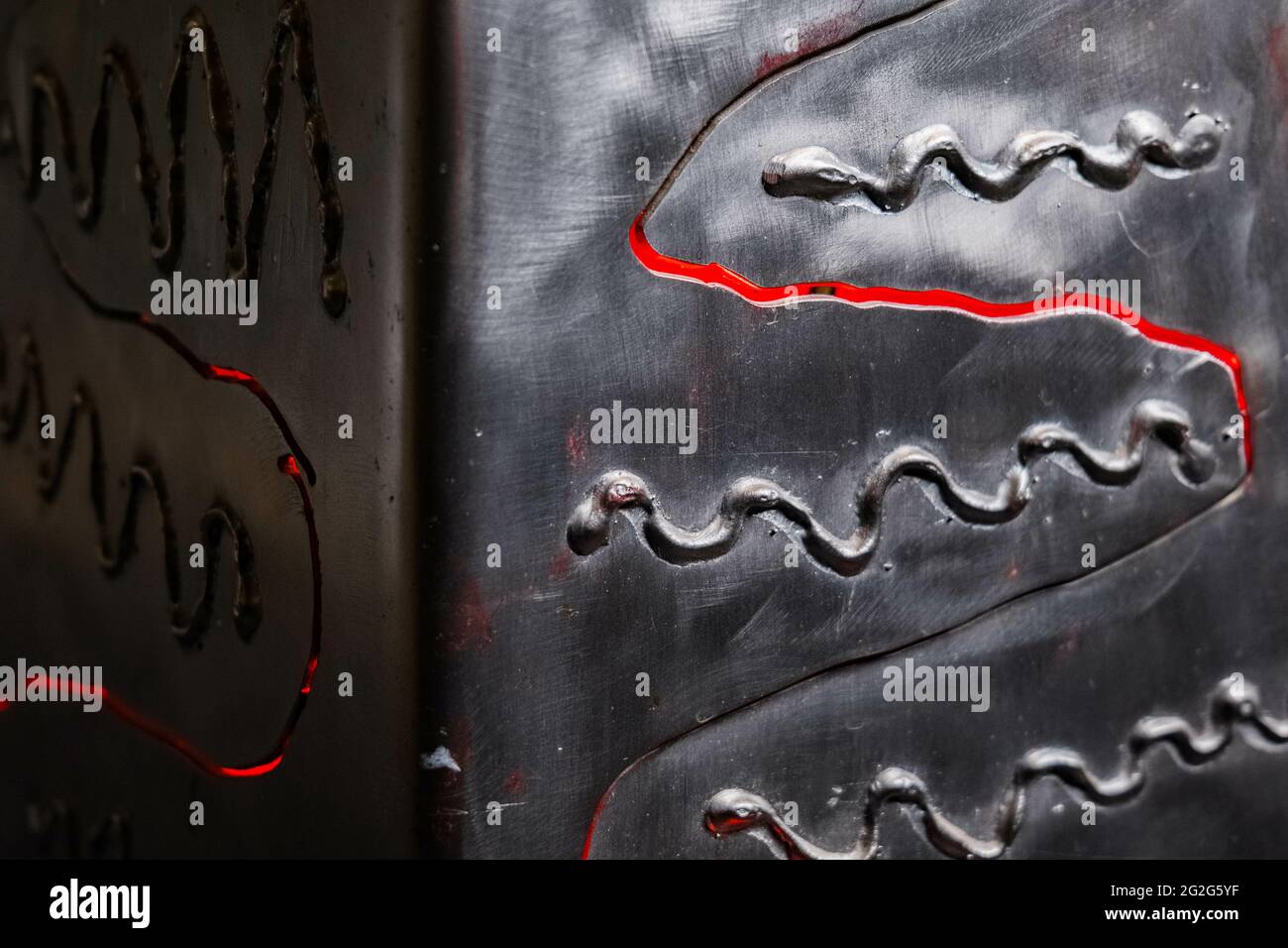 Metal texture with red light Stock Photo - Alamy