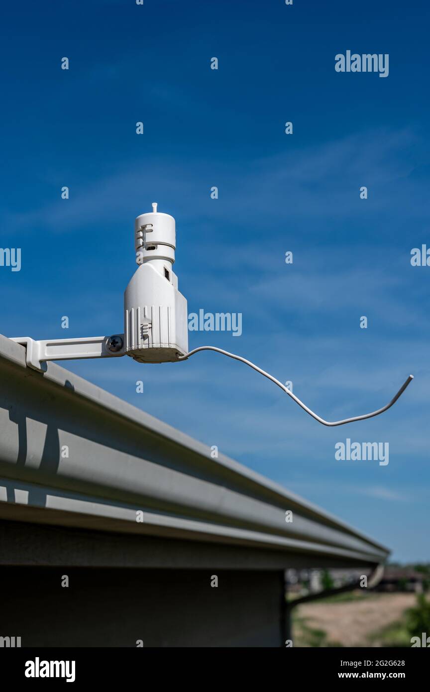 Wireless sprinkler rain sensor used to conserve water. Device is ...