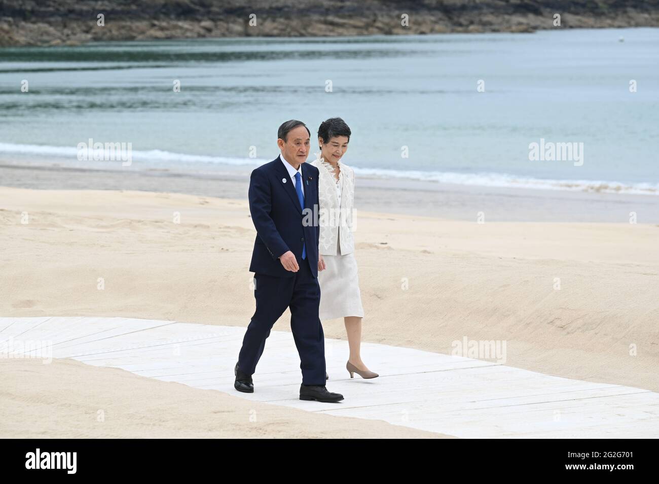 Japanese Prime Minister Yoshihide Suga and his wife Mariko Suga, arrive ...