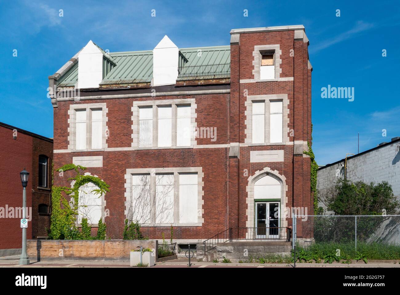 Old brick house with tightly closed windows on three floors Stock Photo ...