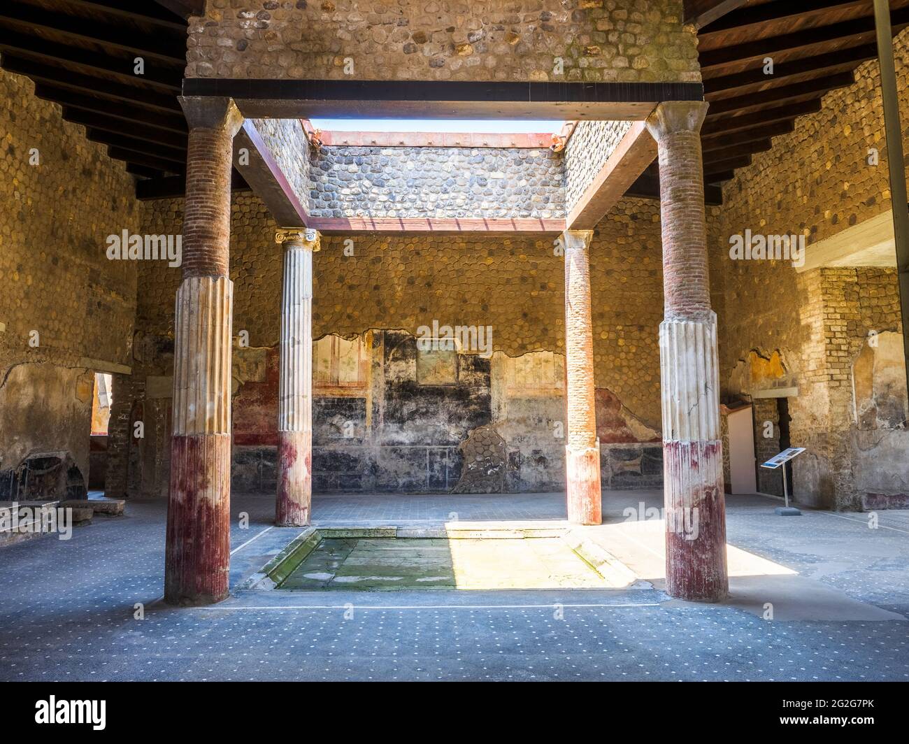 Tetrastyle atrium with four Ionic columns around a central impluvium ...