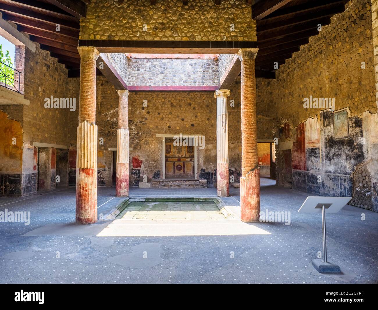 Tetrastyle atrium with four Ionic columns around a central impluvium ...