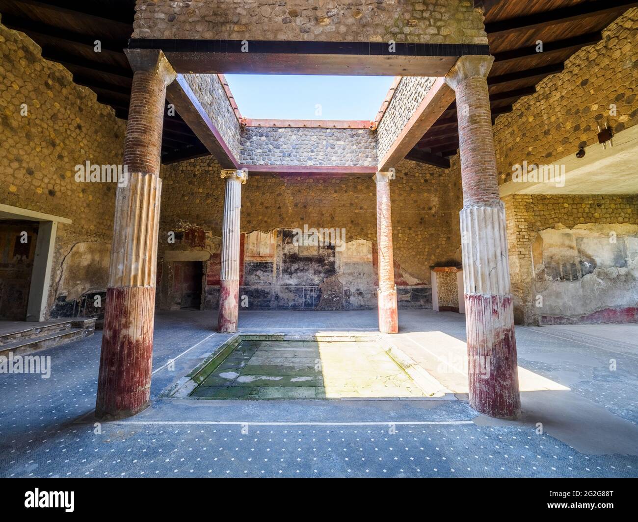Tetrastyle atrium with four Ionic columns around a central impluvium ...