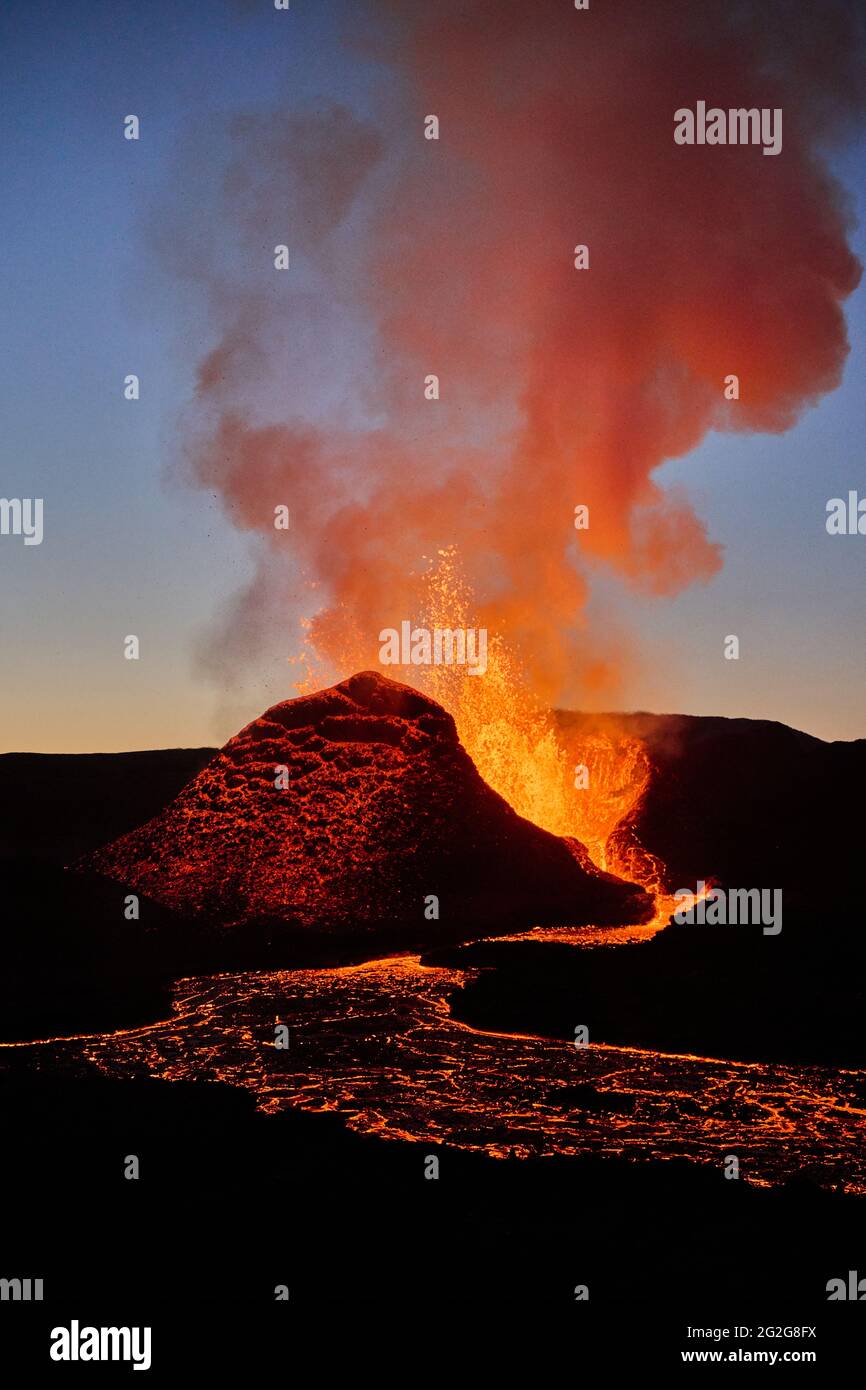 Amazing volcano landscape during eruption at night Stock Photo - Alamy