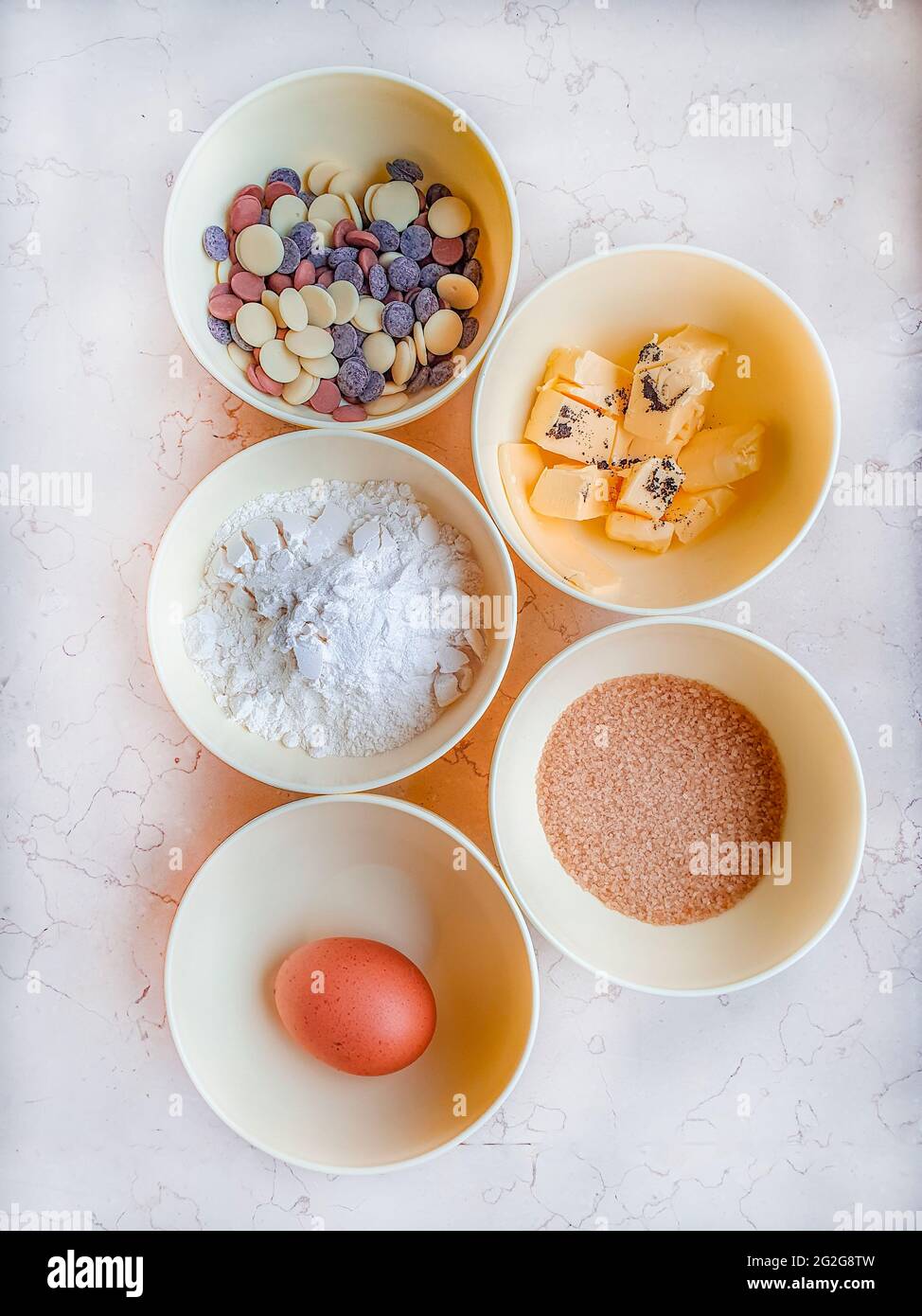 Five bowls of ingredients for triple chocolate cookies. Home baking ...