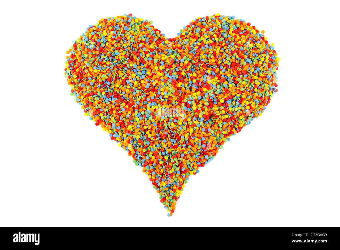 Colored sugar sprinkle dots laid in heart shape isolated on white Stock ...