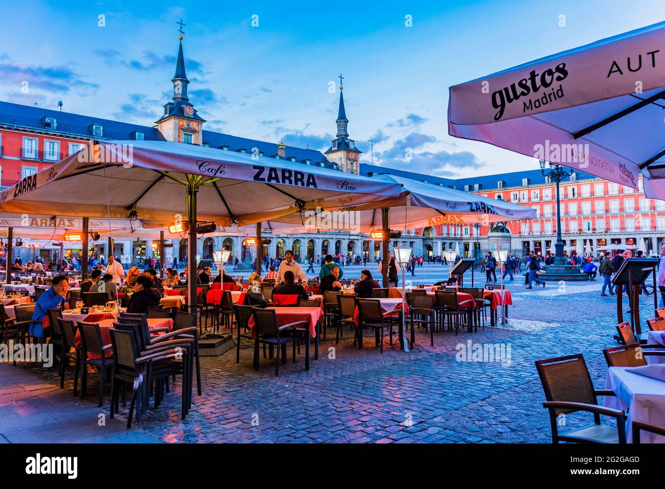 Restaurants bars and terraces at dusk. The Plaza Mayor, Main Square, is ...