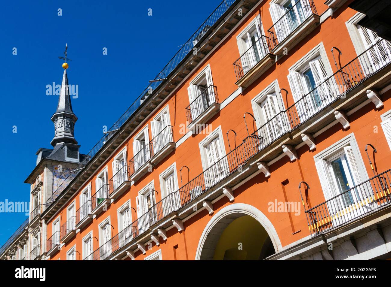 Windows and balconies in the red buildings of the Plaza Mayor. The ...