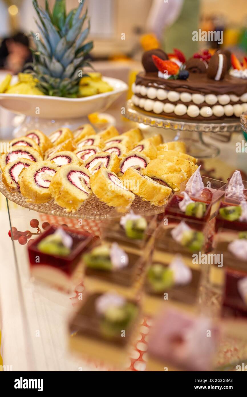 sweet roll on the table with sweets to children Stock Photo - Alamy