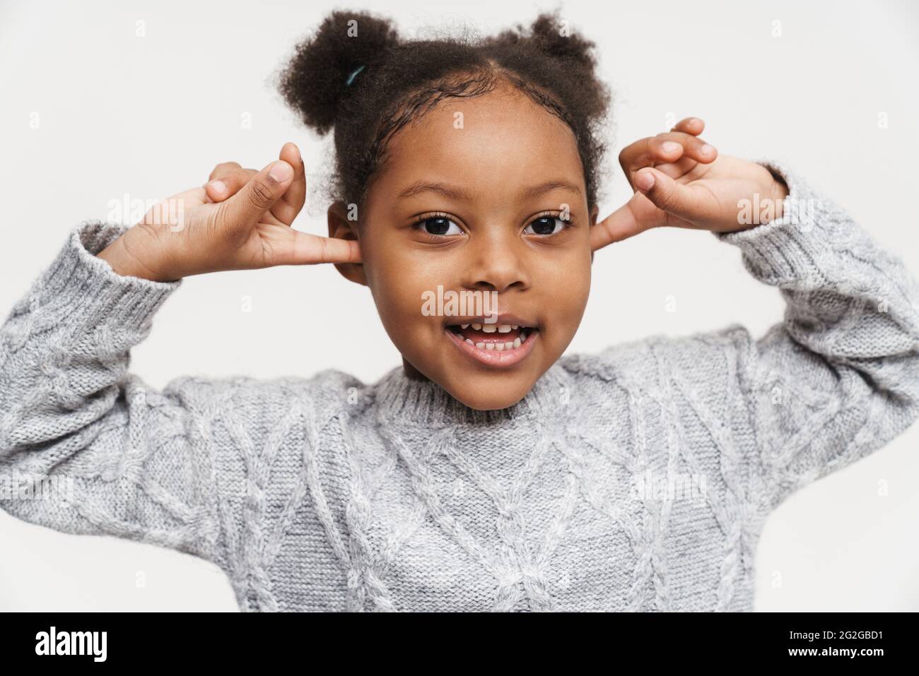 Child plugging ears hi-res stock photography and images - Alamy