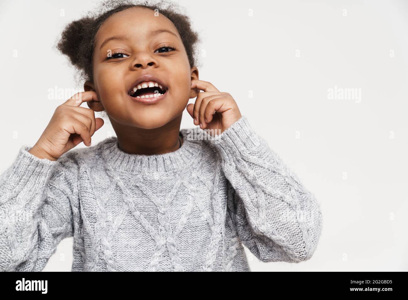 Child plugging ears hi-res stock photography and images - Alamy