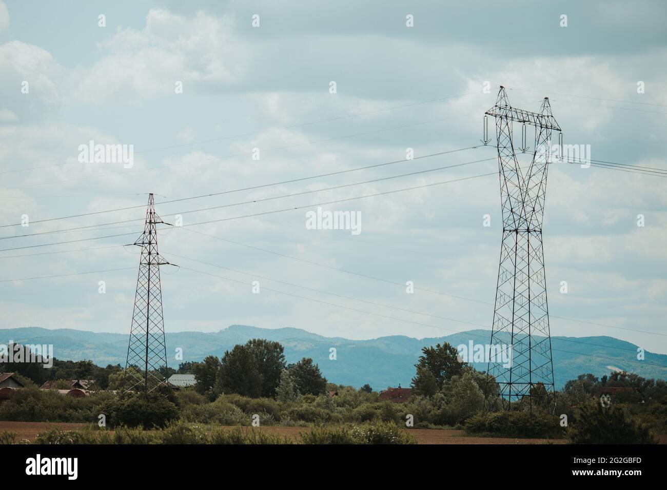 Transmission towers in a field Stock Photo - Alamy