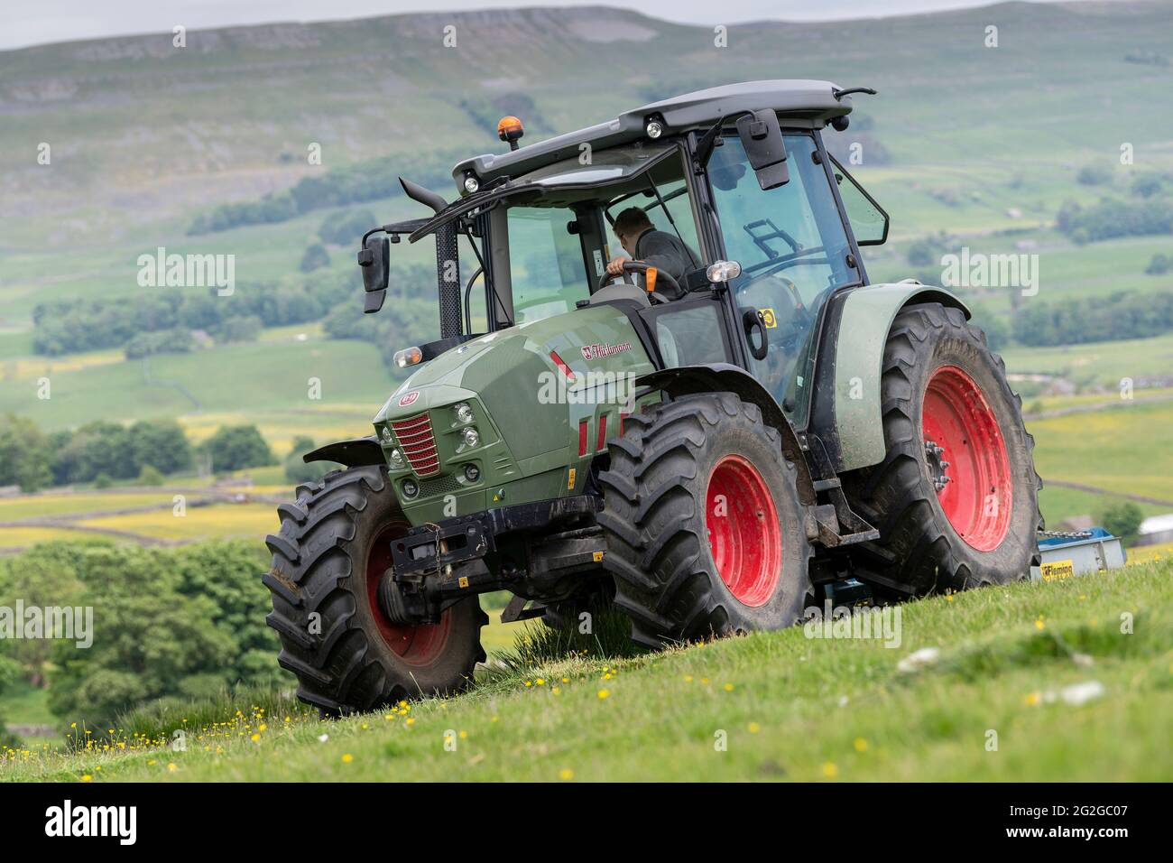 Pasture topping an upland pasture, with a Hurlimann tractor and Fleming ...