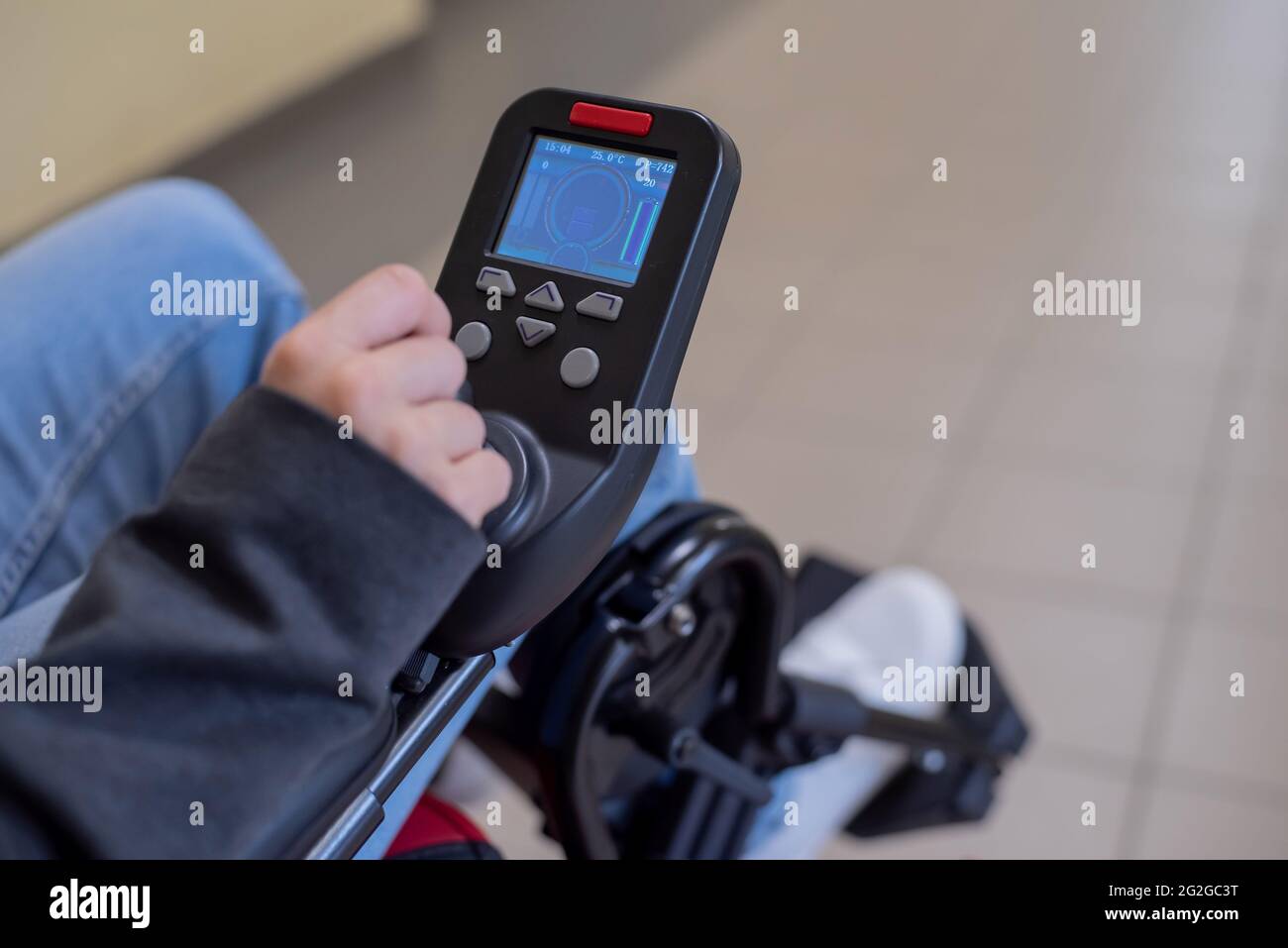 Close-up of a female hand on the control handle of an electric ...