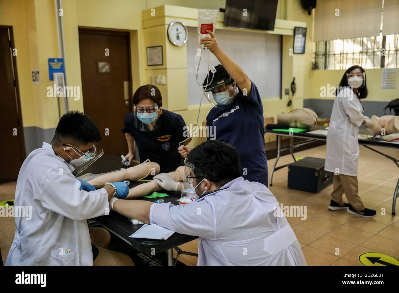 Manila, Philippines. June 10th 2021. Medical students wearing lab gowns ...