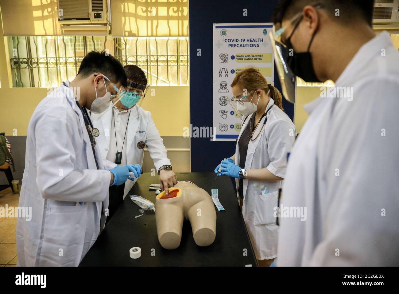 Manila, Philippines. June 10th 2021. Medical students wearing lab gowns ...
