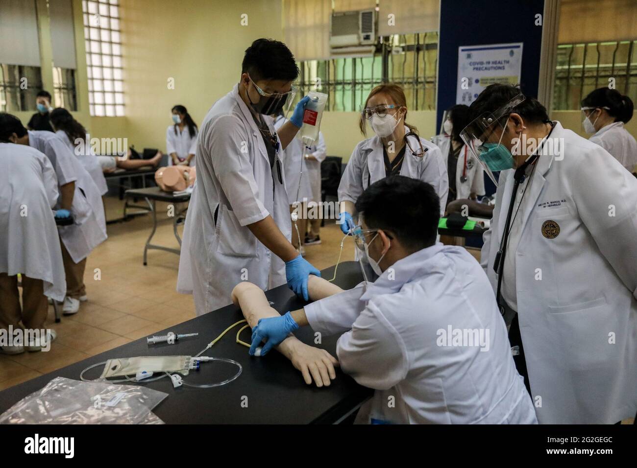 Manila, Philippines. June 10th 2021. Medical students wearing lab gowns ...