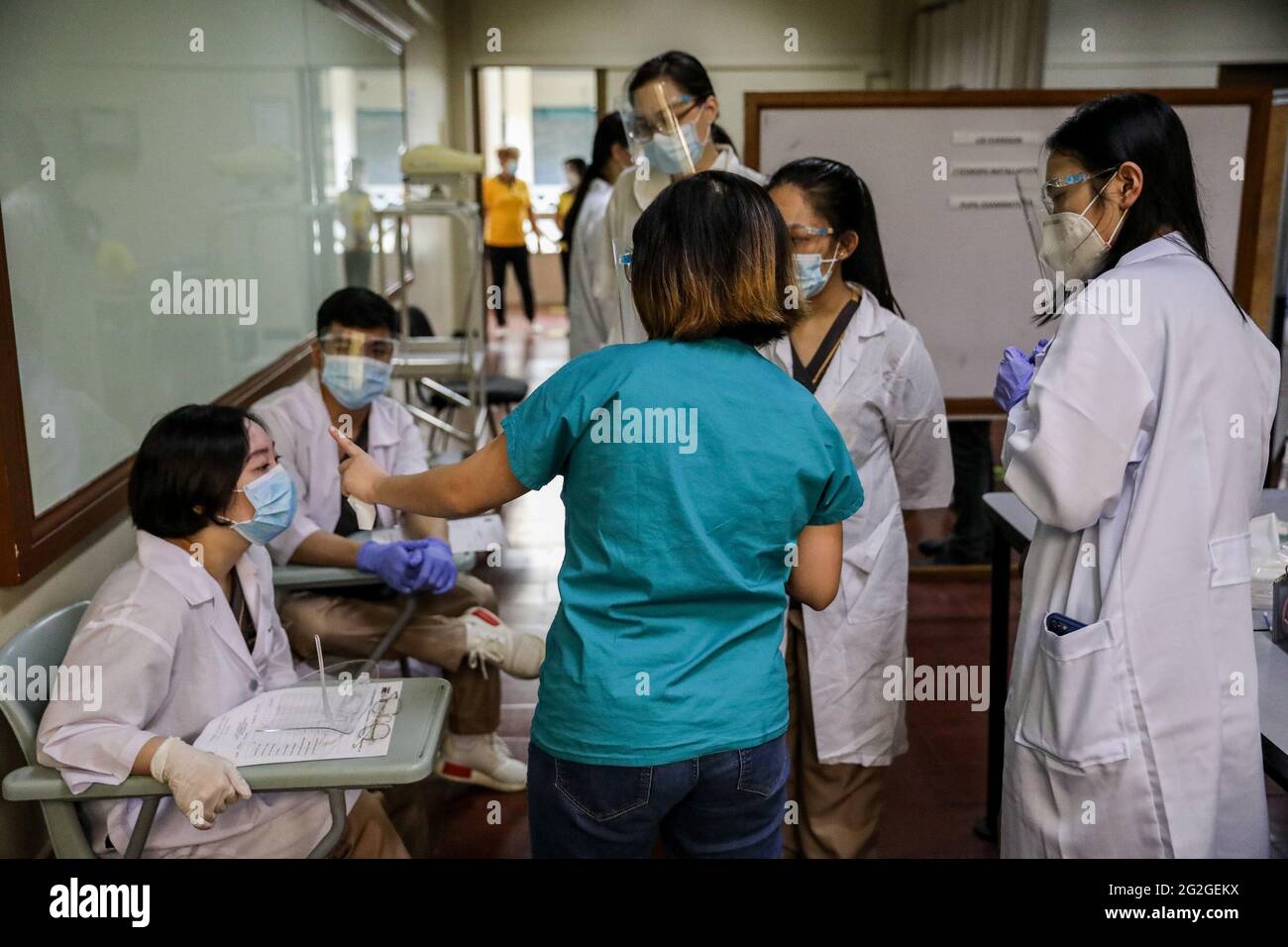 Manila, Philippines. June 10th 2021. Medical students conduct a pupil ...