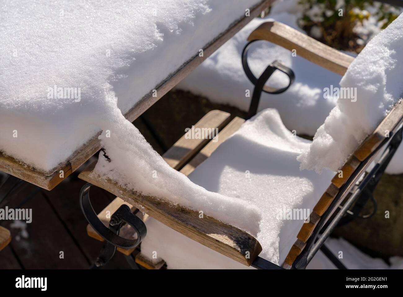Snow-covered beer garden in Bavaria Stock Photo - Alamy