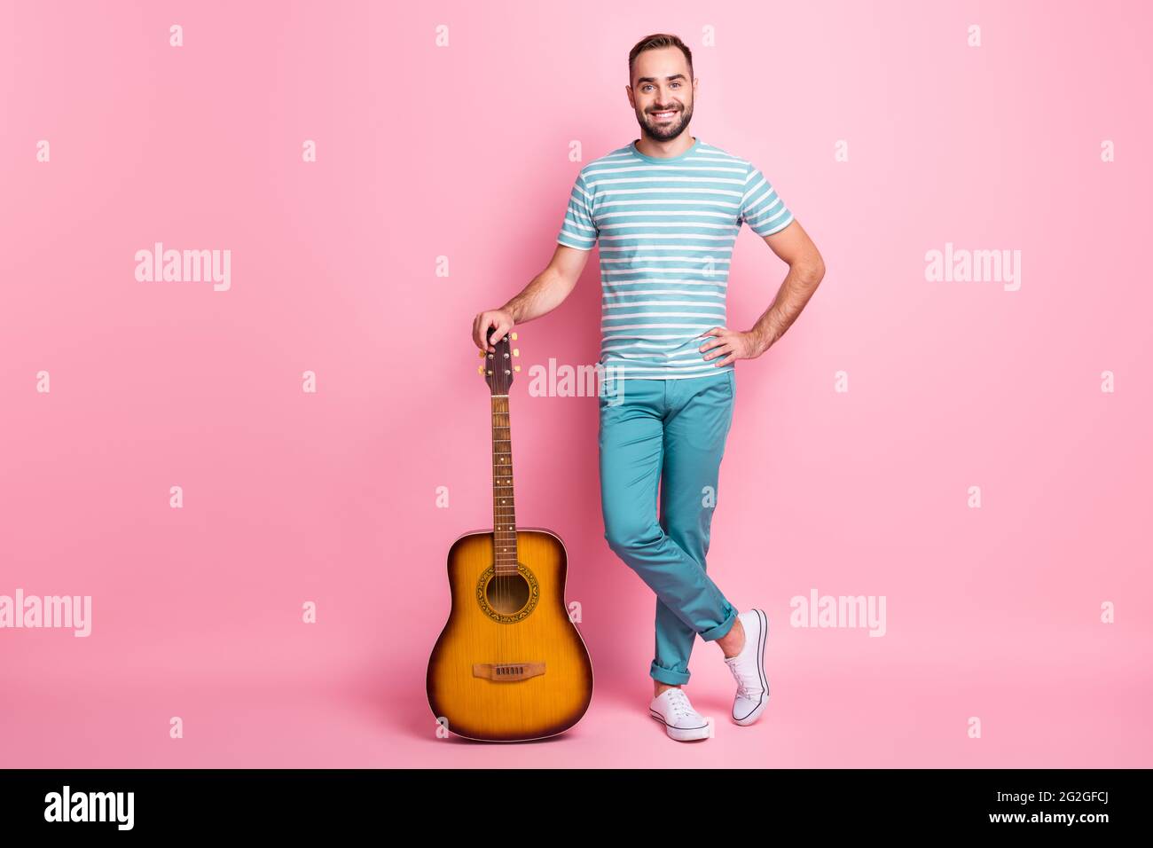 Full length body size view of attractive cheerful guy holding string ...