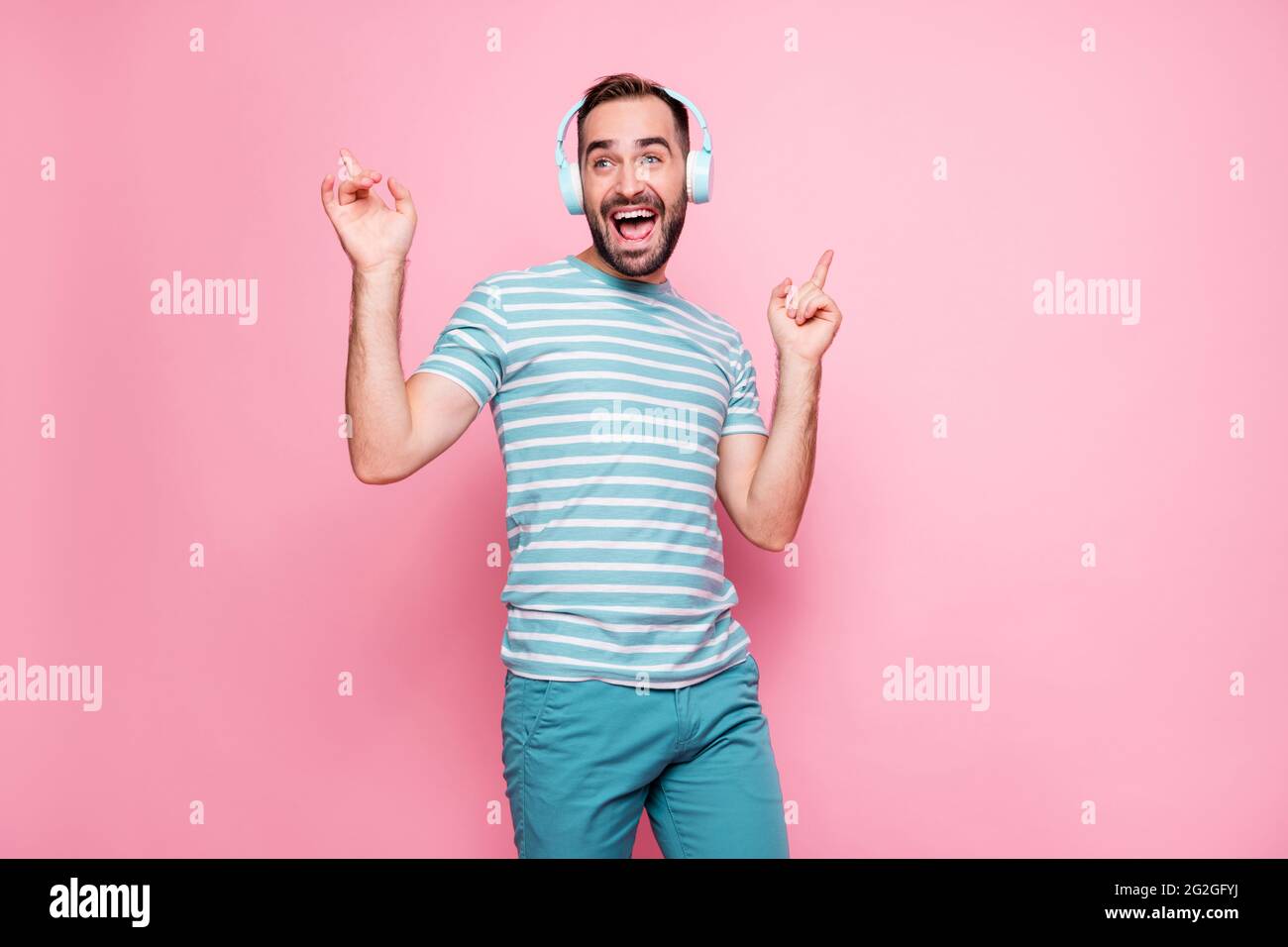 Portrait of attractive cheerful funky guy meloman fan enjoying ...