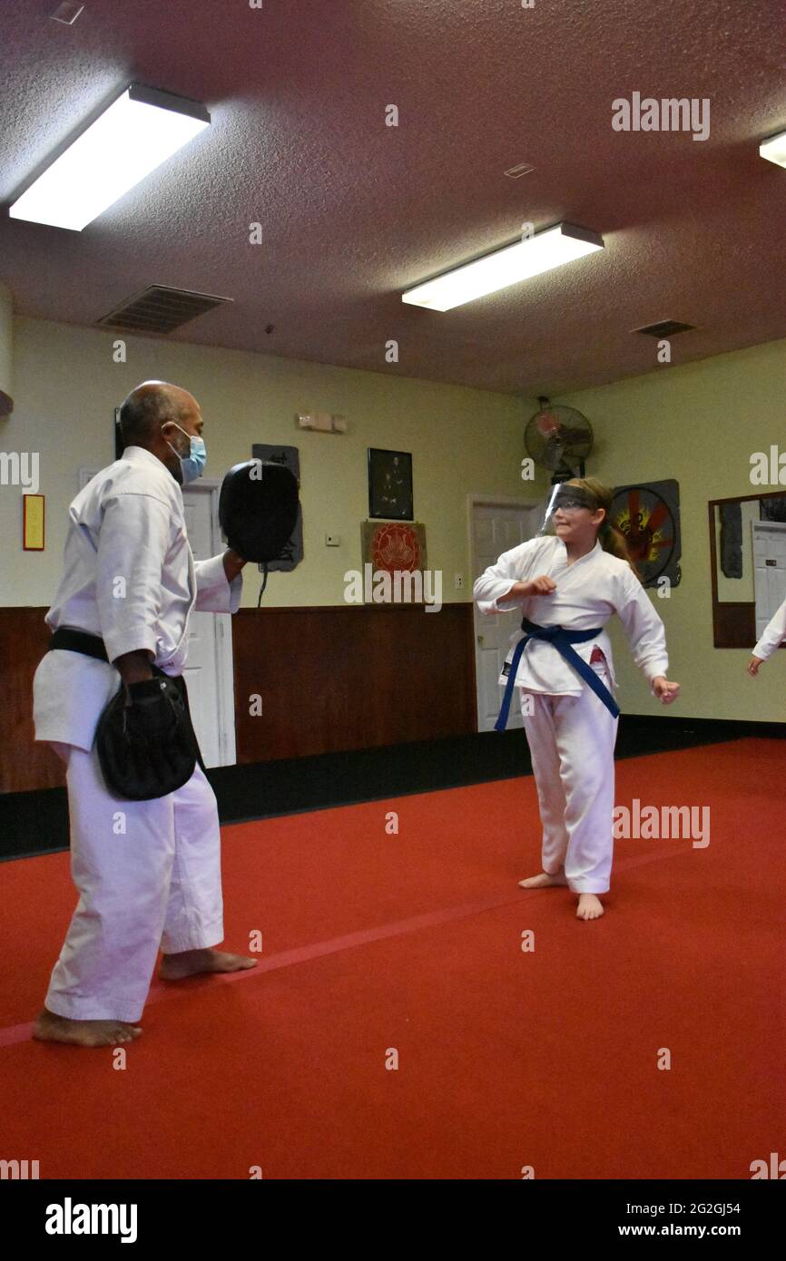 This action photo is of my daughter in her Karate class. Karate is a ...