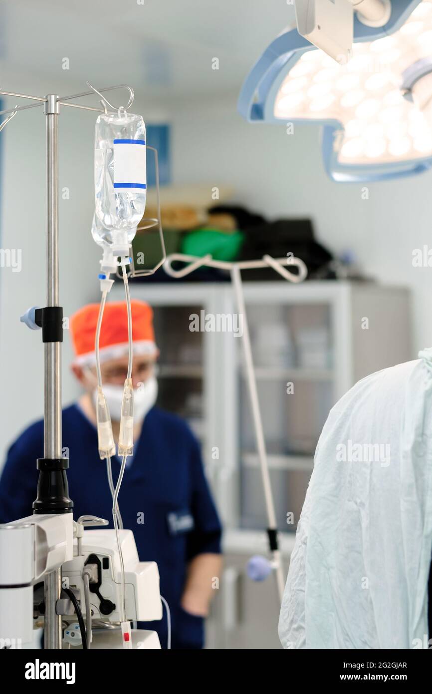 Selective focus on drip system and saline plastic bag. Hospital ...