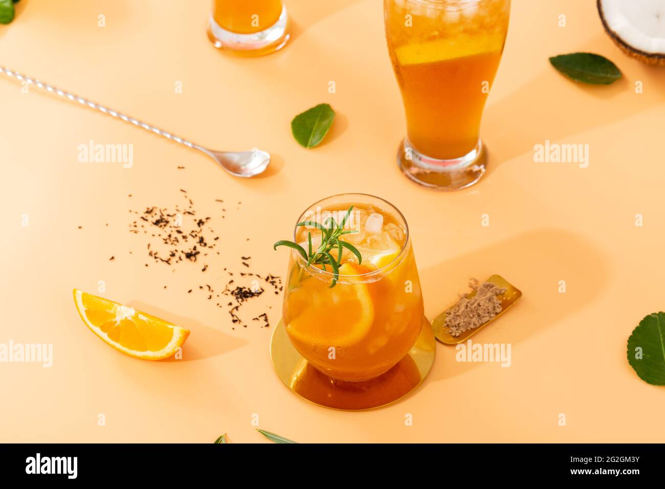 Fresh cocktails with orange isolated on a peachy background Stock Photo ...