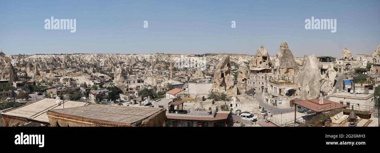 Panoramic view of boutique cave hotels and fairy chimney ruins with ...